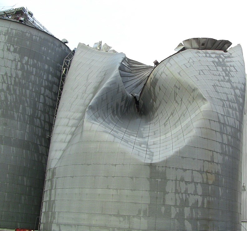 Grain silo collapses; spills tons of grain on road causing crashes