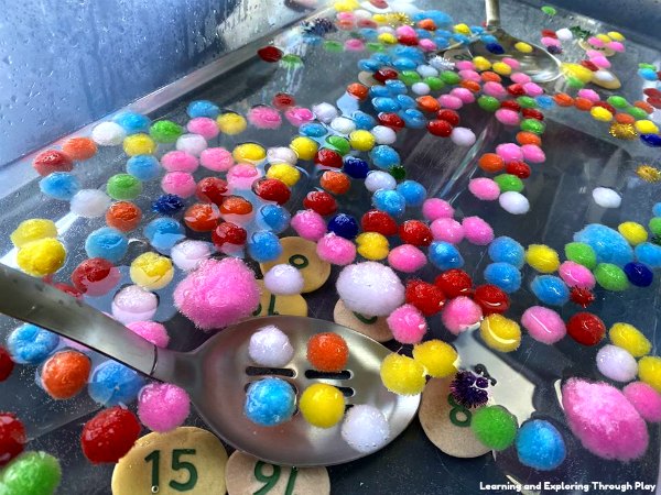 Learning and Exploring Through Play: Pom Pom Water Play