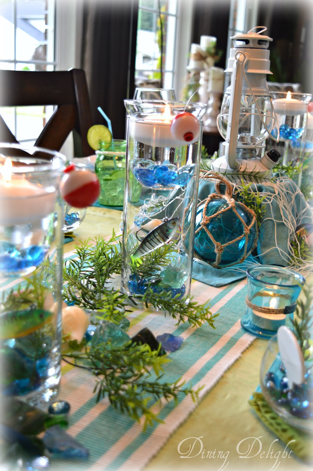 Dining Delight: Fishing Centerpiece in Cylinder Vase