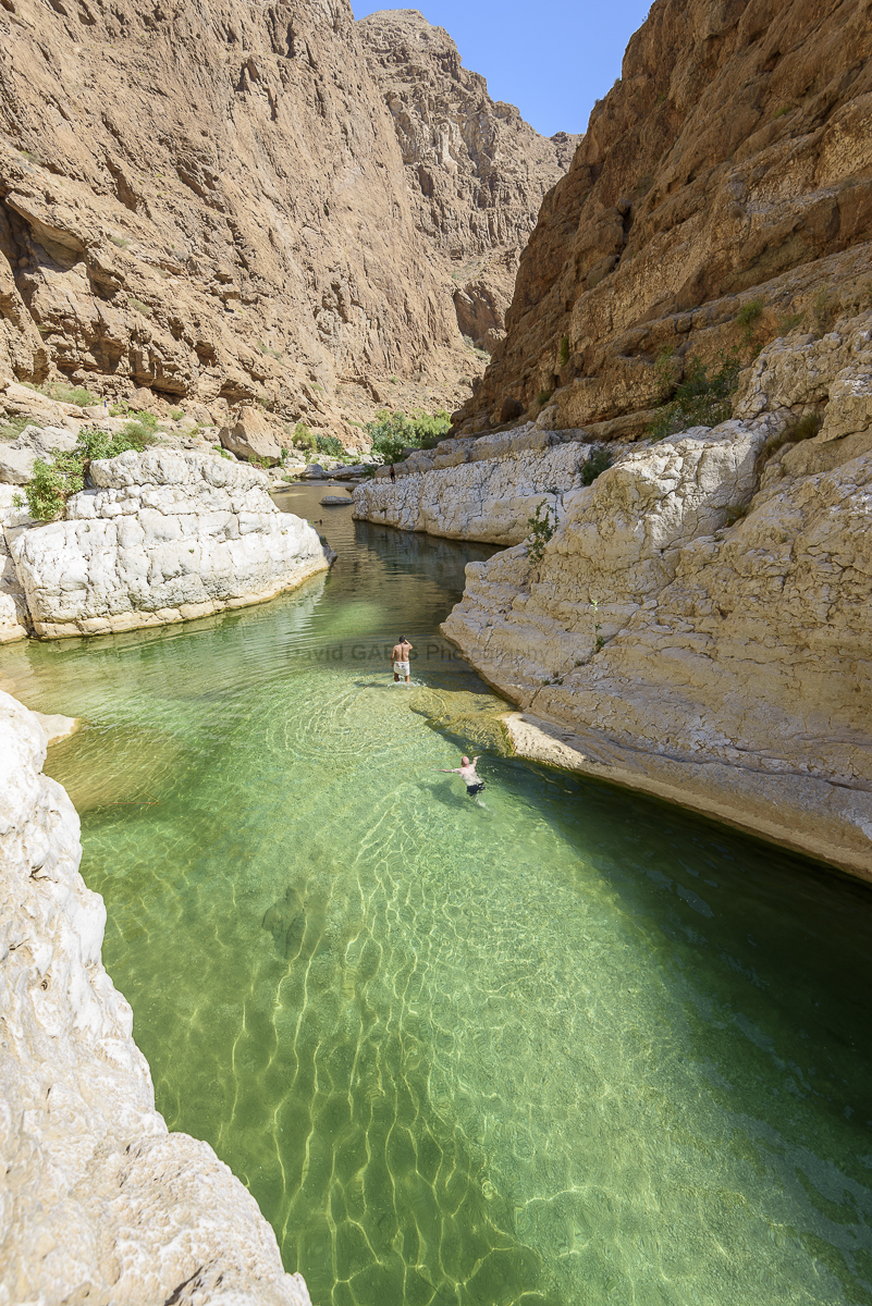 Swimming in the river of Wadi As Shab, Sultanate of Oman