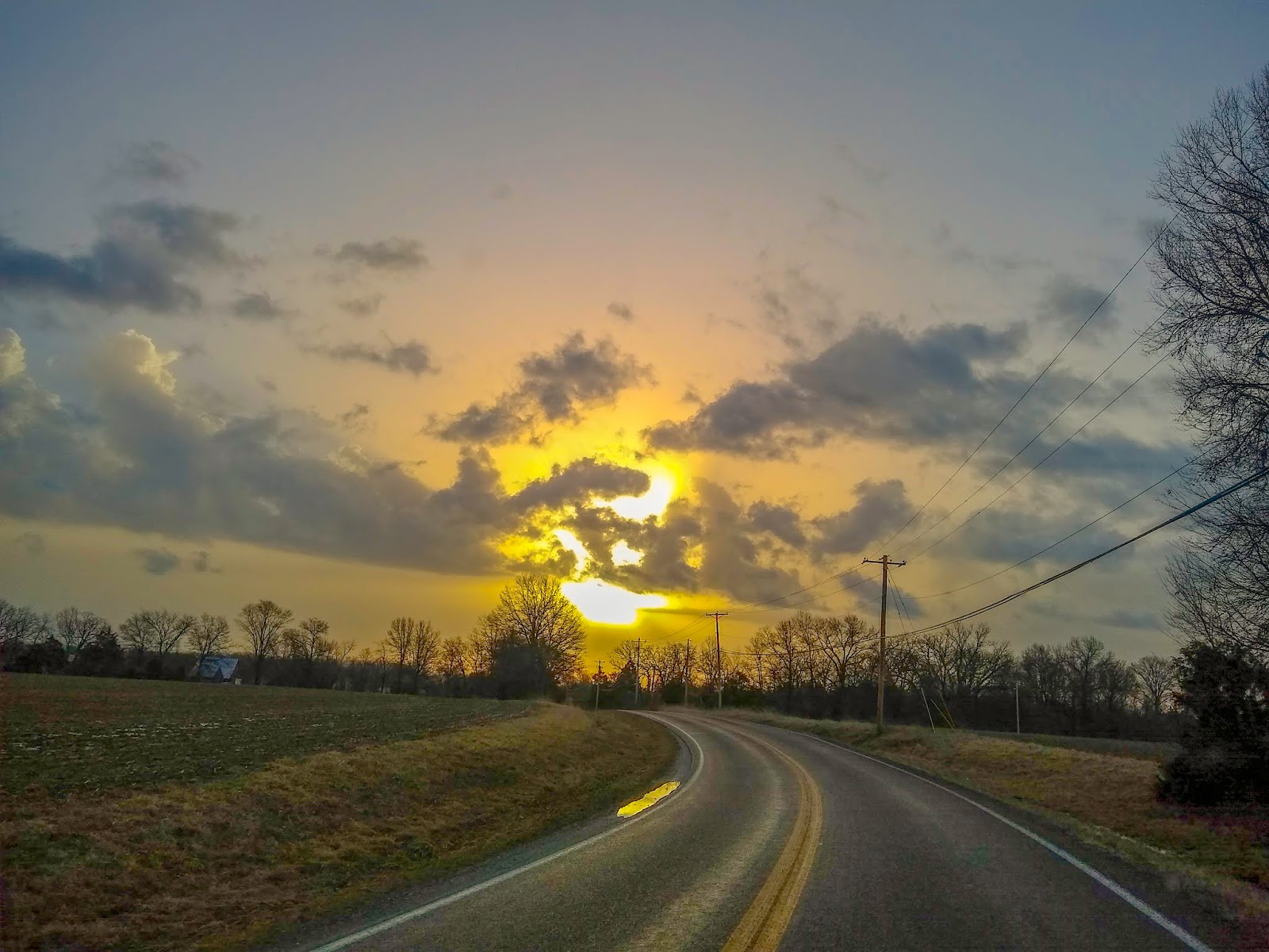 Sunset on windy country road in Warrenton Missouri