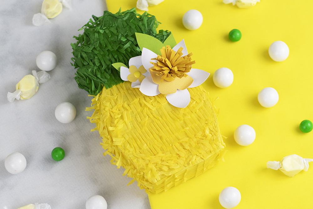 Pinata DIY: Personalizing a Pineapple Pinata with Tropical Flowers ...