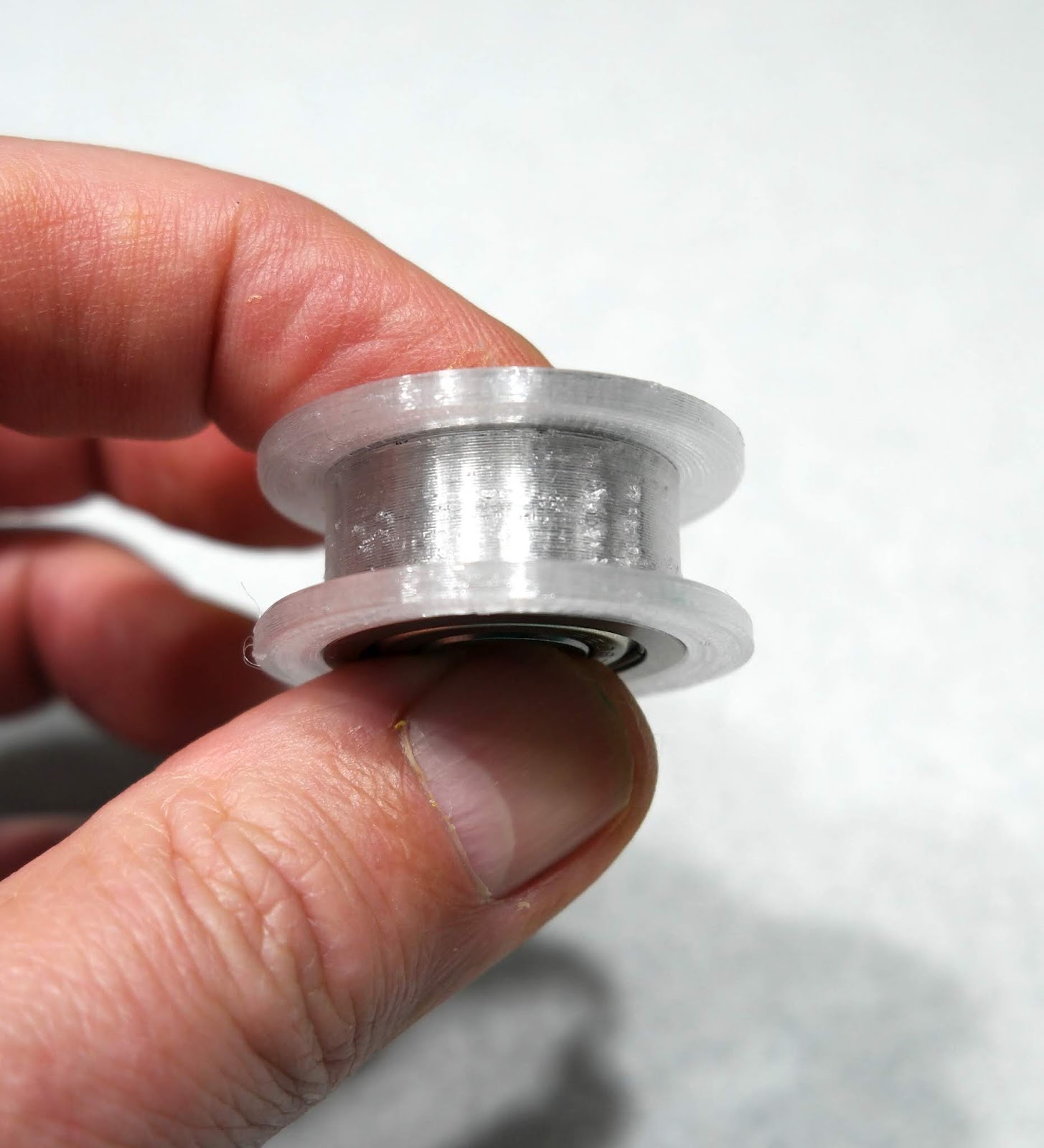 Wide flanged pulleys made from flanged ball bearings