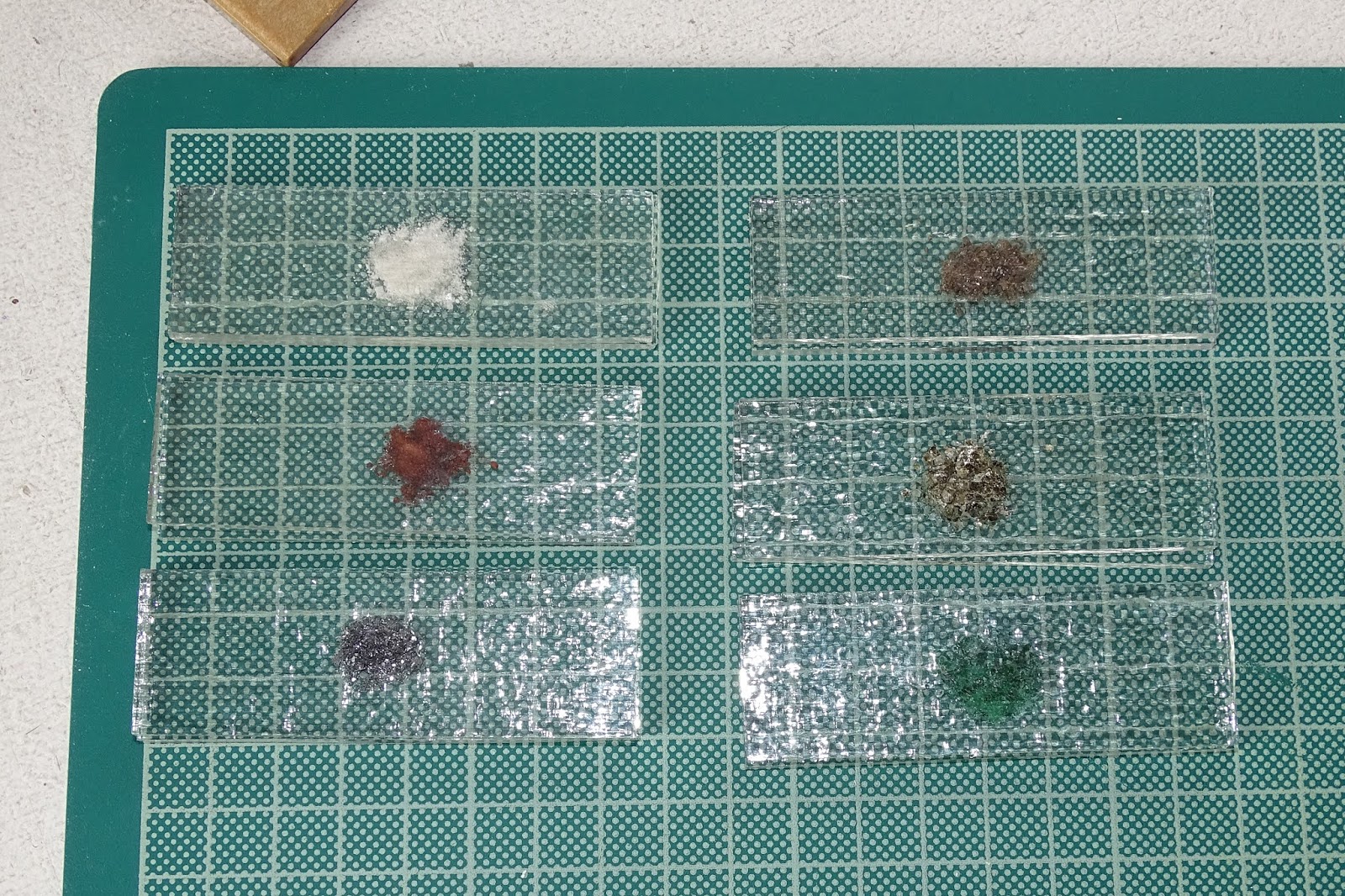 Experiments with mineral inclusions within fused glass