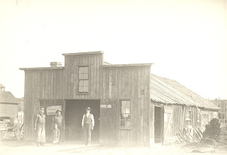 Old photos of architecture: View of an old feed store