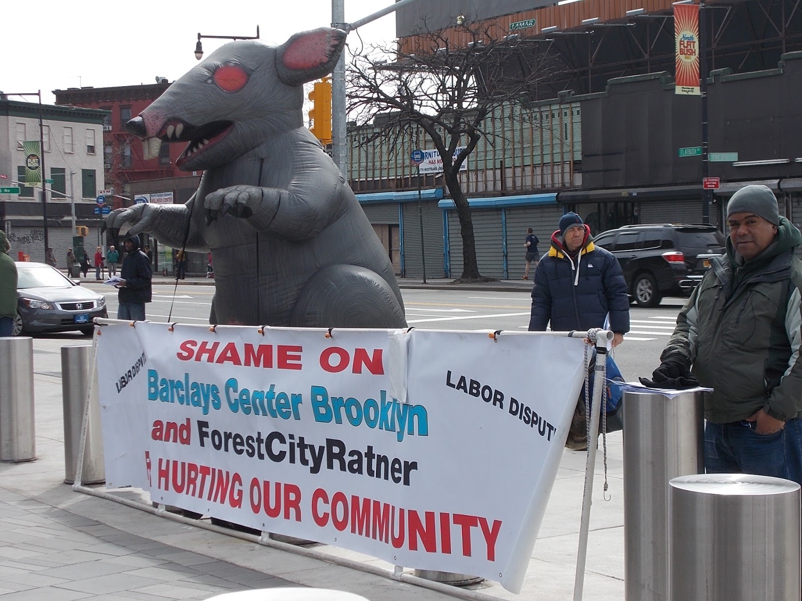 Inflatable rats, symbols of union protest, placed outside the Barclays ...