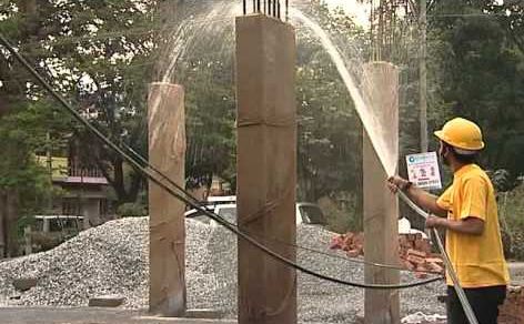 CONCRETE CURING BY POURING WATER