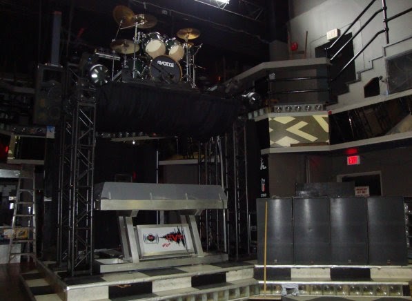 The Stage Spot: Drum riser on Truss above DJ in Club