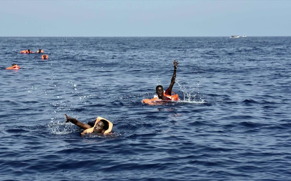 Photos of African migrants stepping over dead bodies after being ...