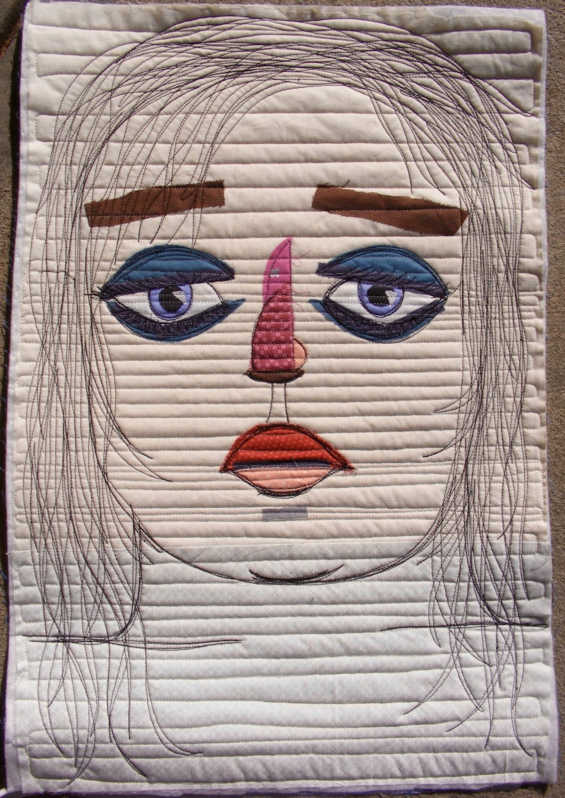 TIA CURTIS QUILTS: I have also been making faces.