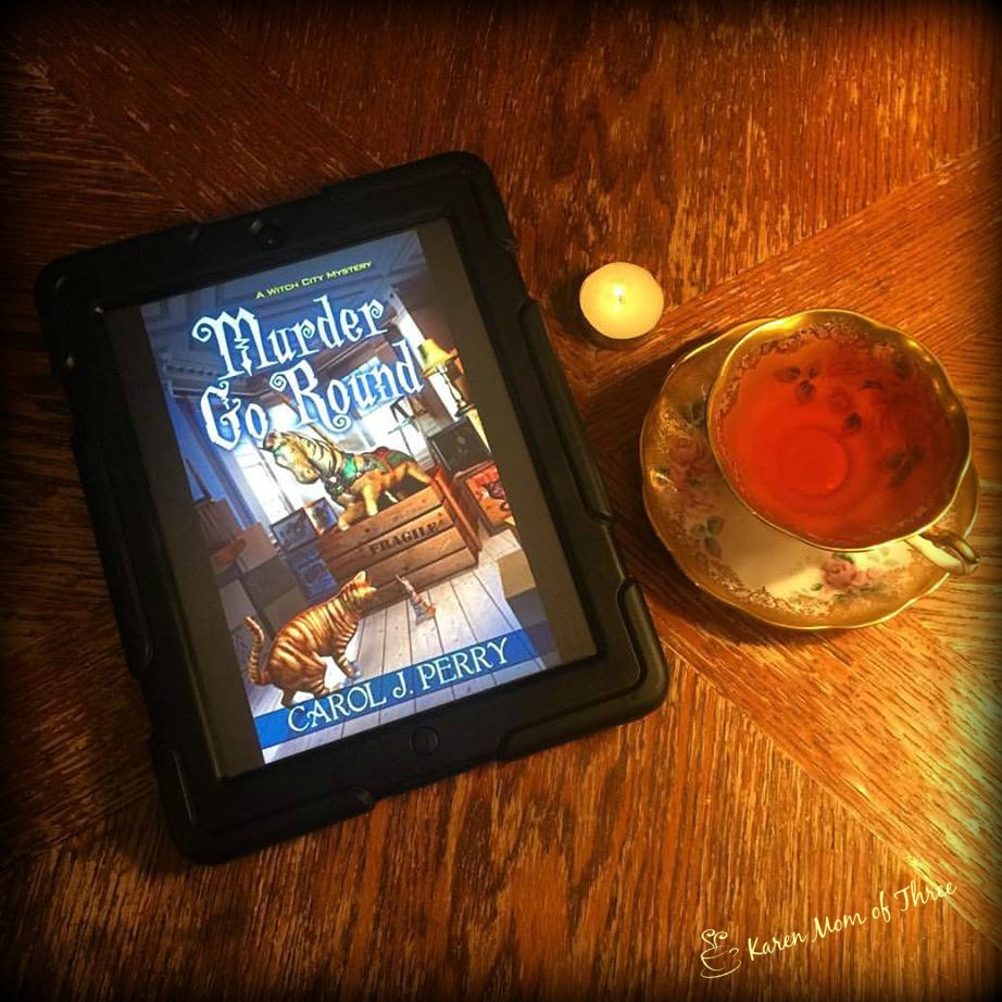 A Cup Of Tea and A Cozy Mystery: Murder Go Round by Carol J. Perry