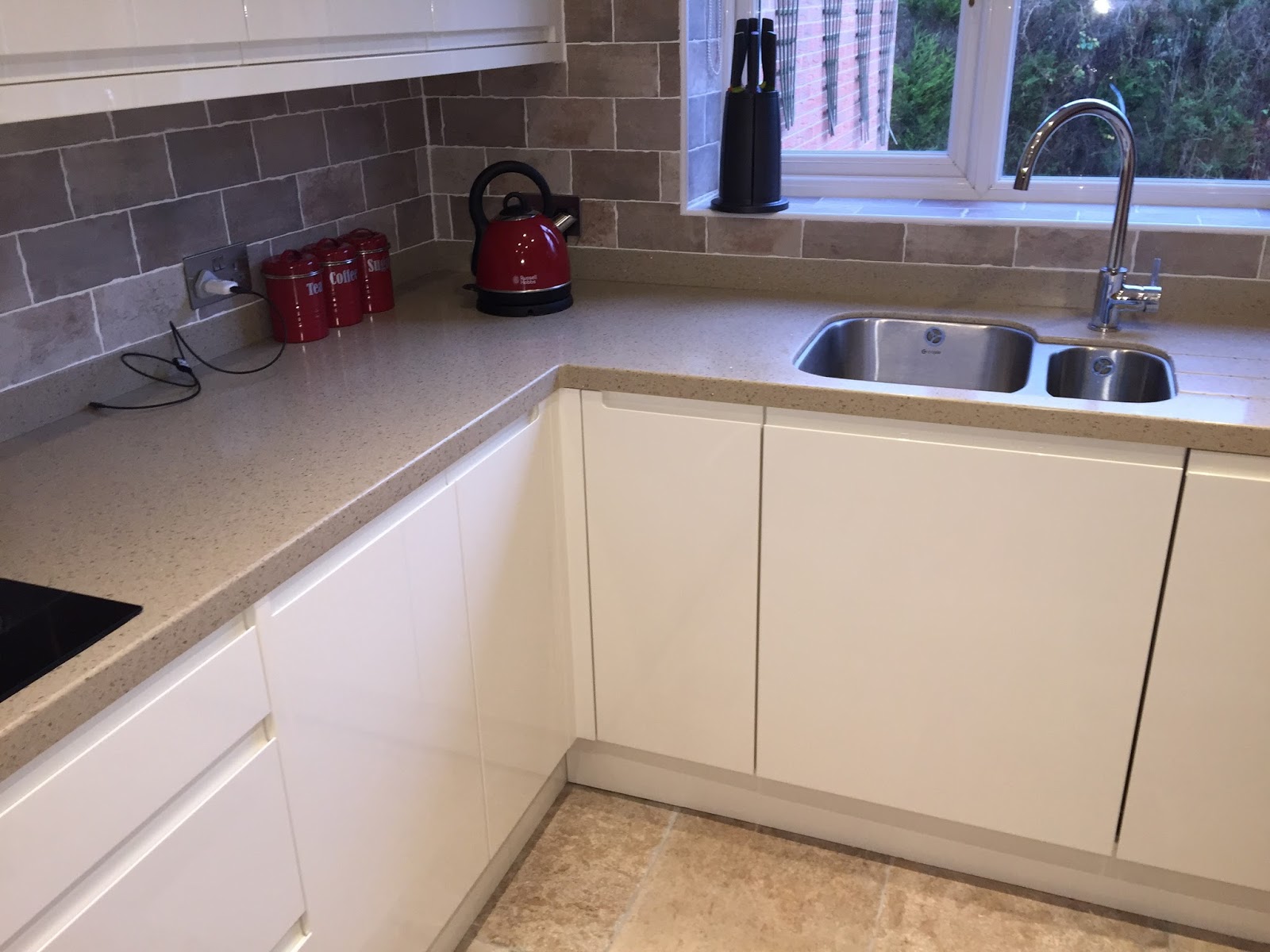 Tates Kitchens: Ivory gloss kitchen with staron tempest worktops ...