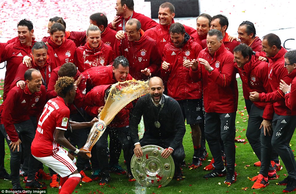 Bayern Munich players drench Pep Guardiola in beer after winning German ...