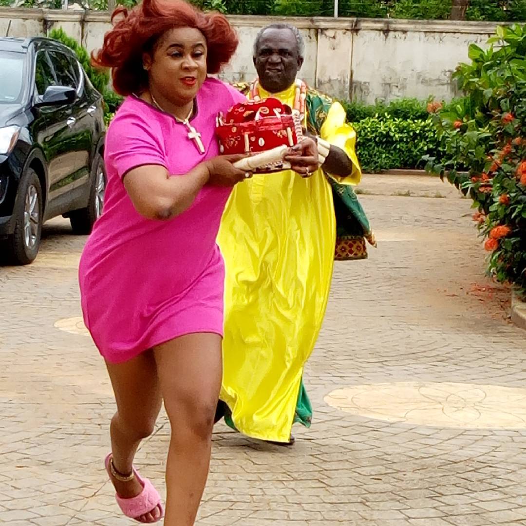 No, Uju Okoli is not Obi Okoli's Biological or real daughter.