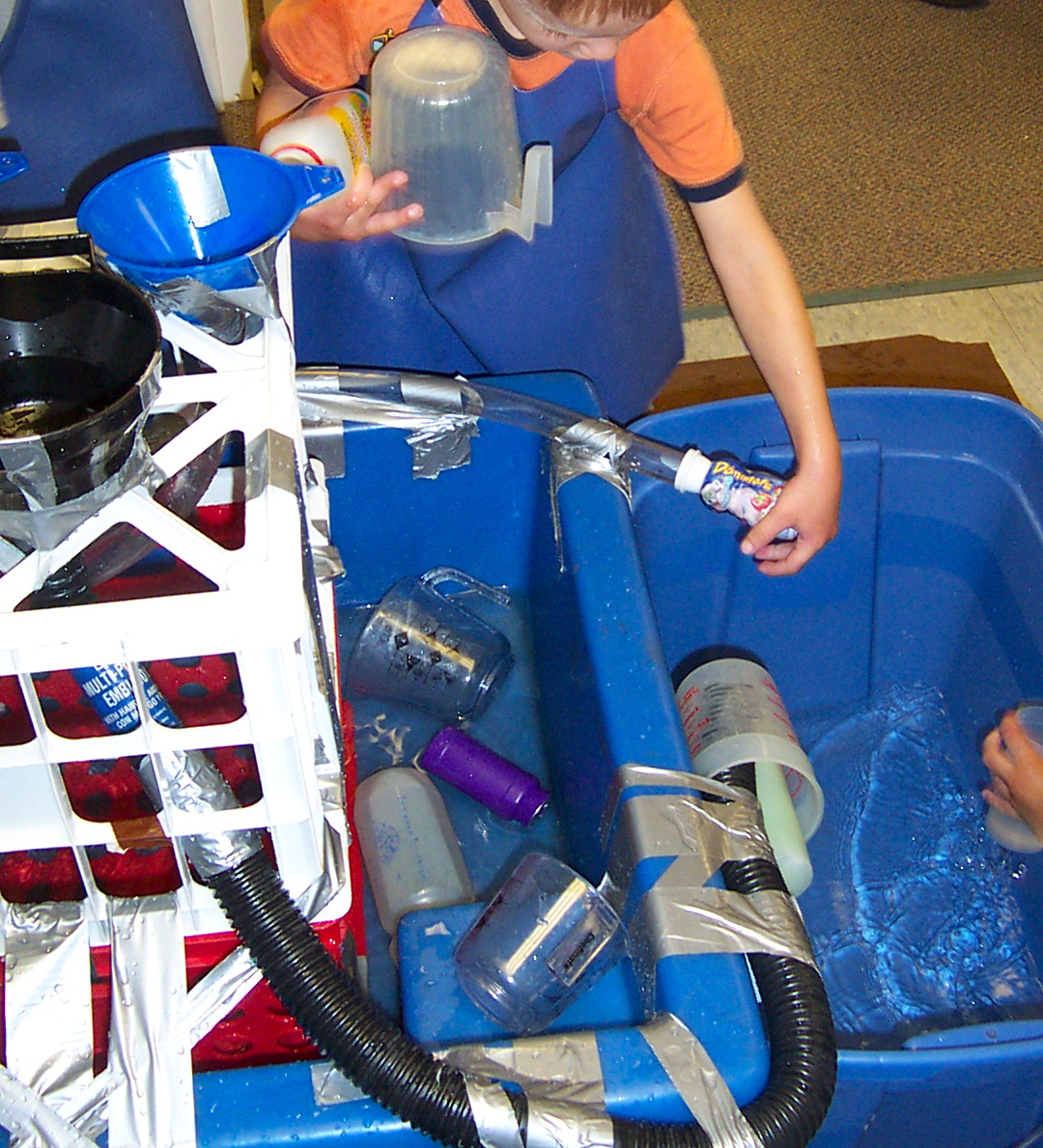 SAND AND WATER TABLES: Funnels and Clear Plastic Tubing - Experimenting