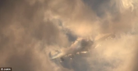 Moment world's largest passenger jet slices through clouds and leaves ...