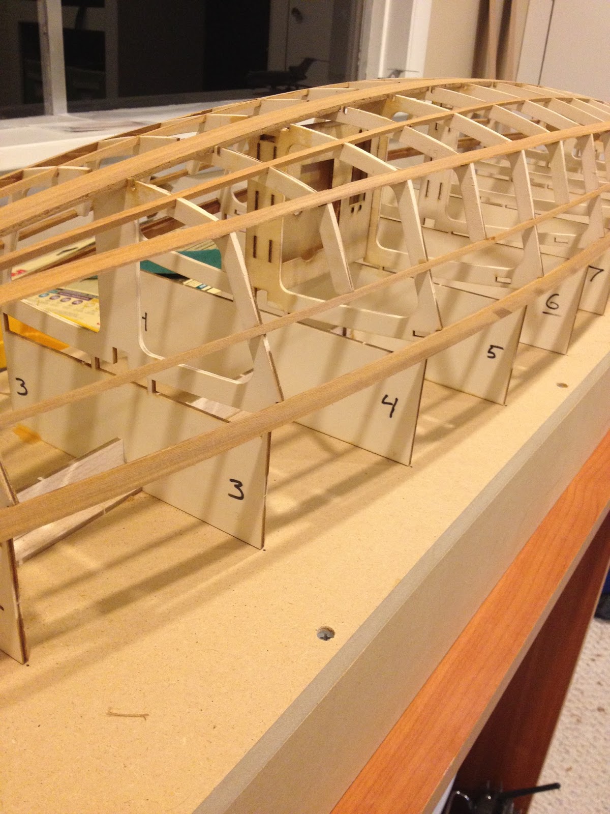 Sheer rails installed and stringers faired