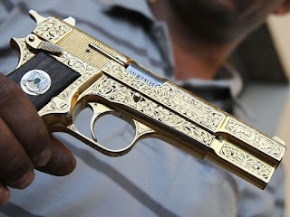 Mummar Gaddafi Gold Weapon : The Golden Piston - Gold Information Blog