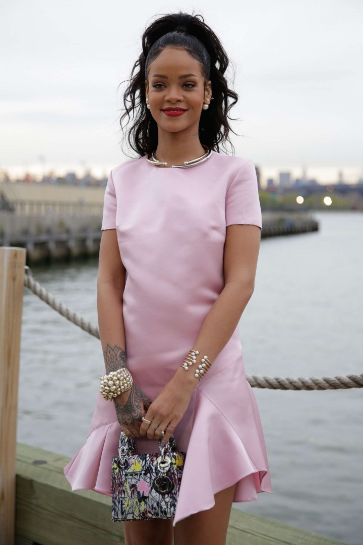 Rihanna keeps it sweet in a pink silk dress at the Dior Cruise 2015 ...