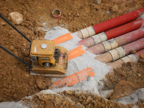 Electrical Installations: Cable duct crossing roadside drain