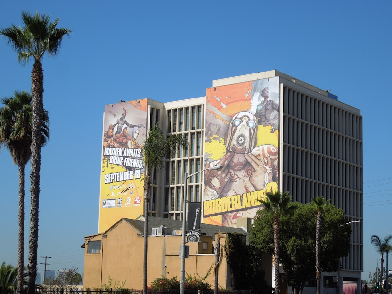 bridesmaids movie: Giant Borderlands 2 video game billboards...