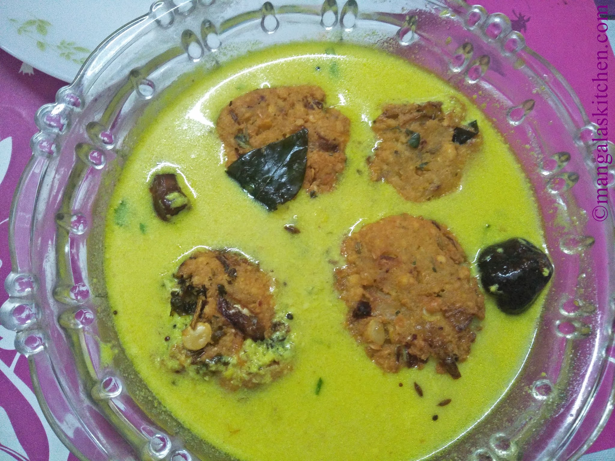 Masala Vadai Mor Kuzhambu | Masala Vadai soaked in Mor Kuzhambu ...