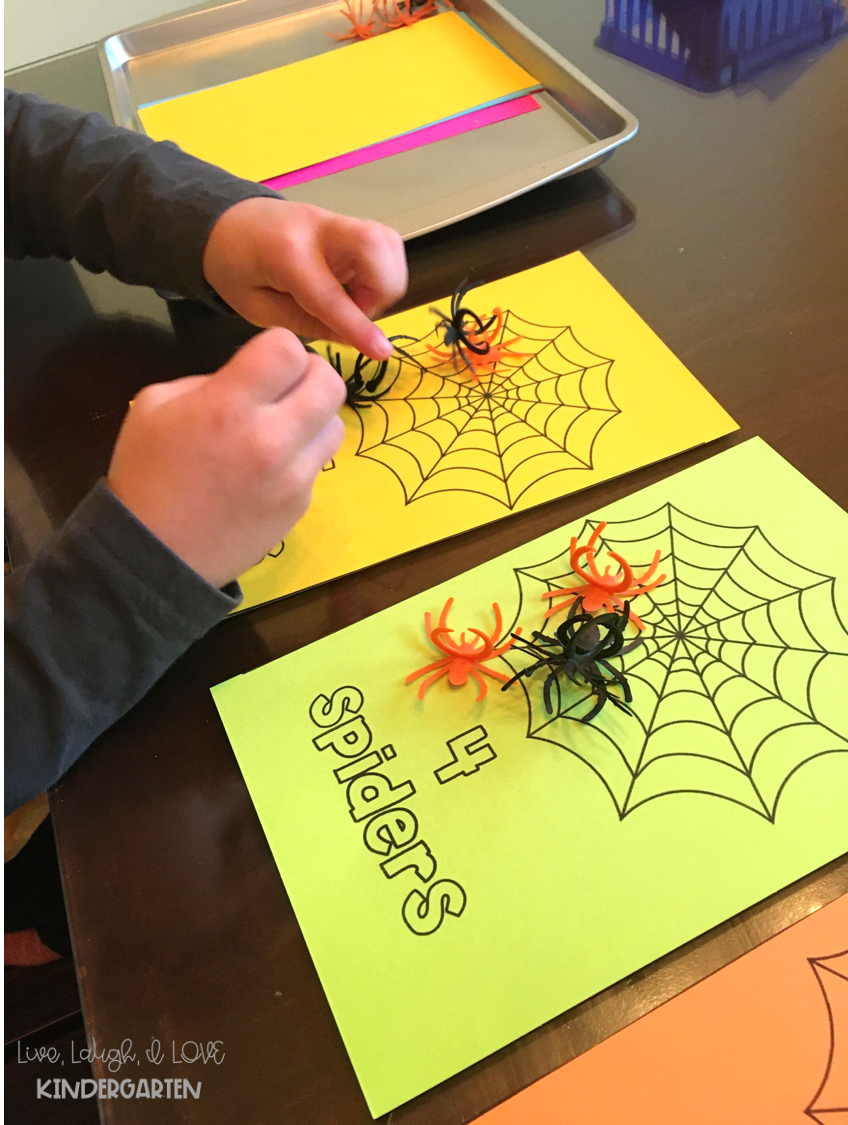 I cut out bats and taped them to a black piece of paper. Then, we took ...