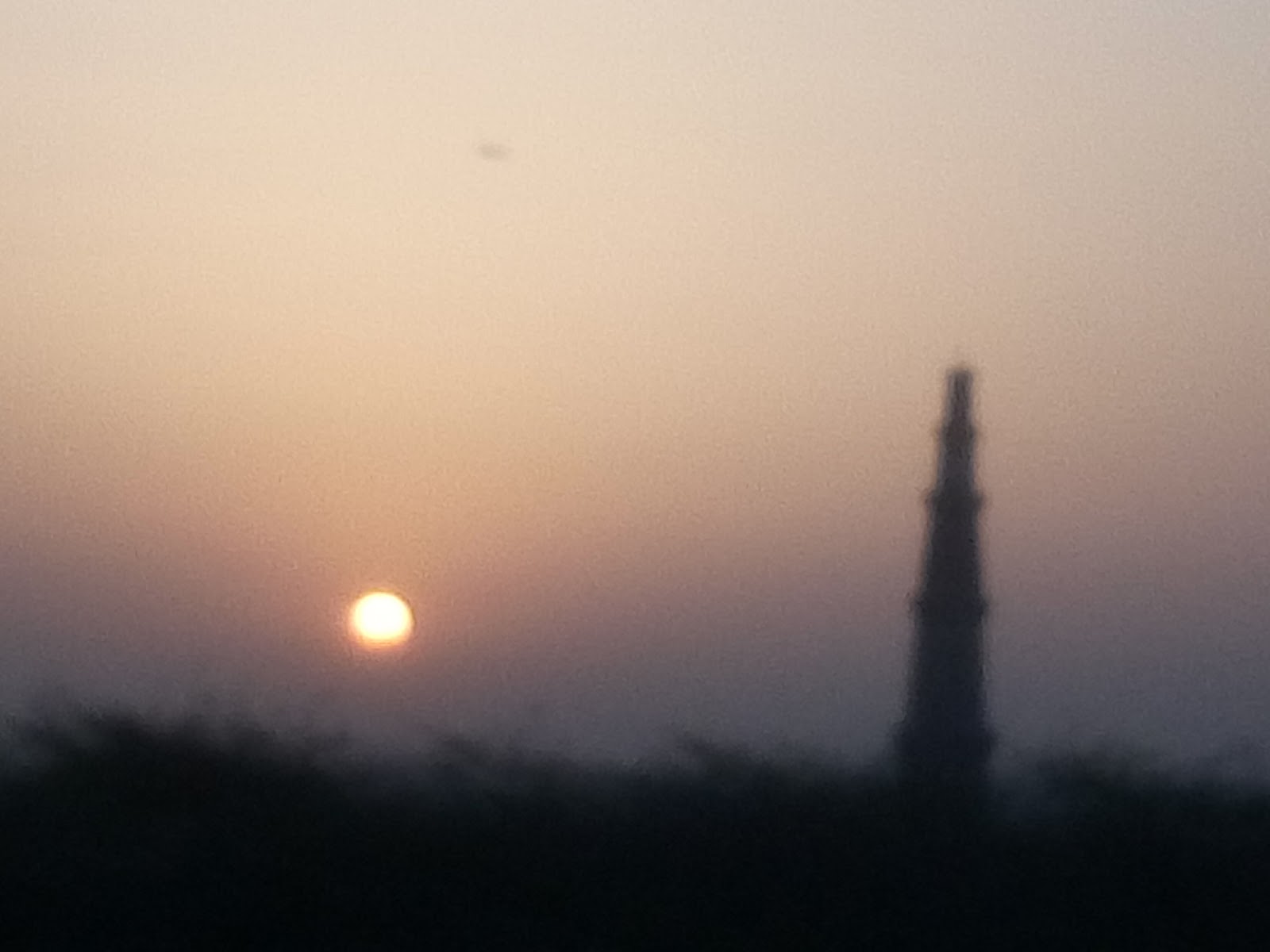 Tharu Dr Ajay Kumar Ojha From The Eyes Of Dr Ajay Kumar Ojha Rising Sun And Standing Qutab Minar
