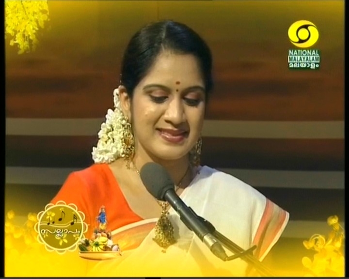 playback singer akhila anand in set saree cute images