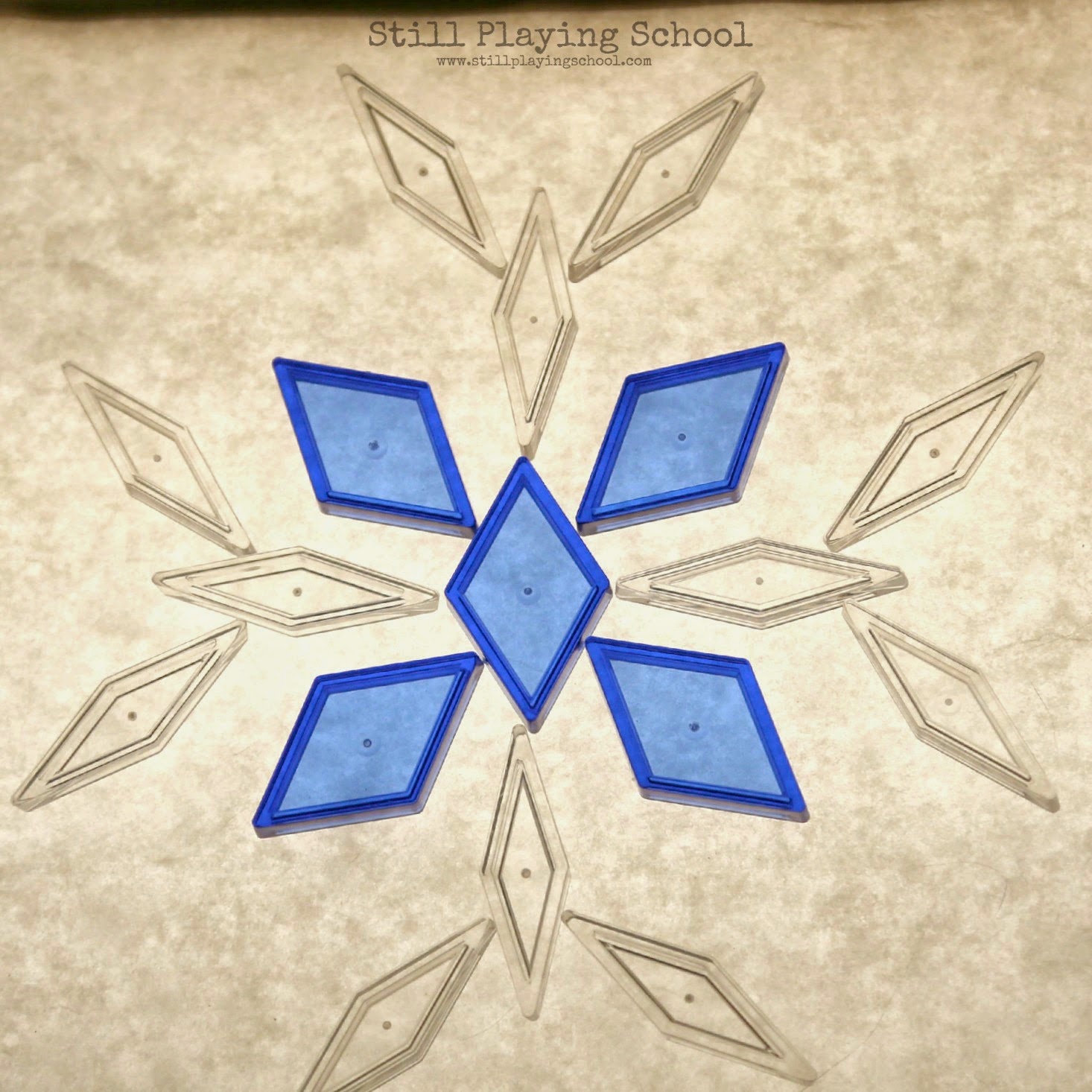 Building Snowflakes on the Light Table | Still Playing School