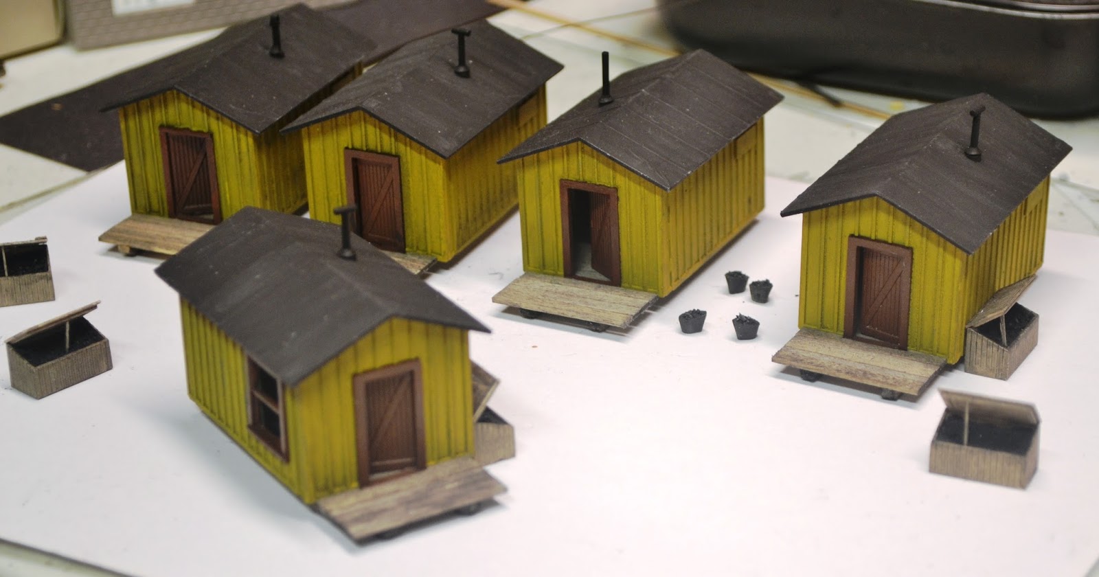 Nirvana Valley Model Railroad: Logging camp cabins, outhouses, and a boat