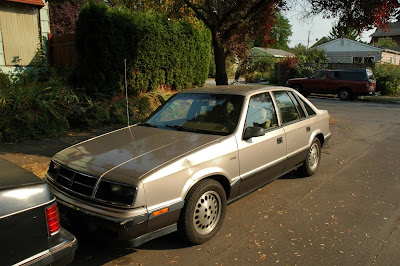 OLD PARKED CARS.: The American Dream: 2X 1986 Dodge Lancer ES Turbo.