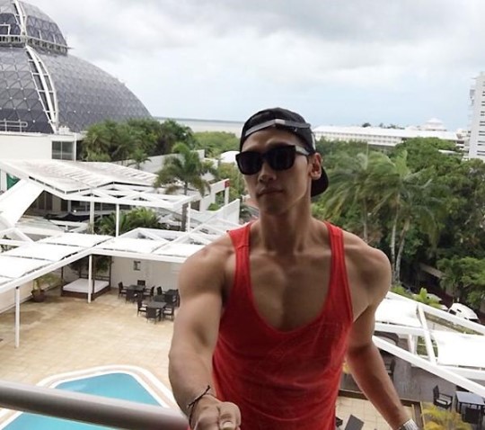 Rain shows off his chiseled muscles while hanging out in Australia
