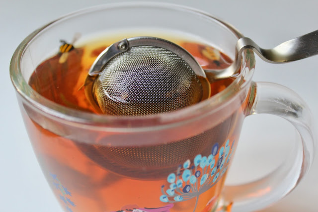 Tea With Friends: A Mesh Tea Ball with Cup Rest Handle