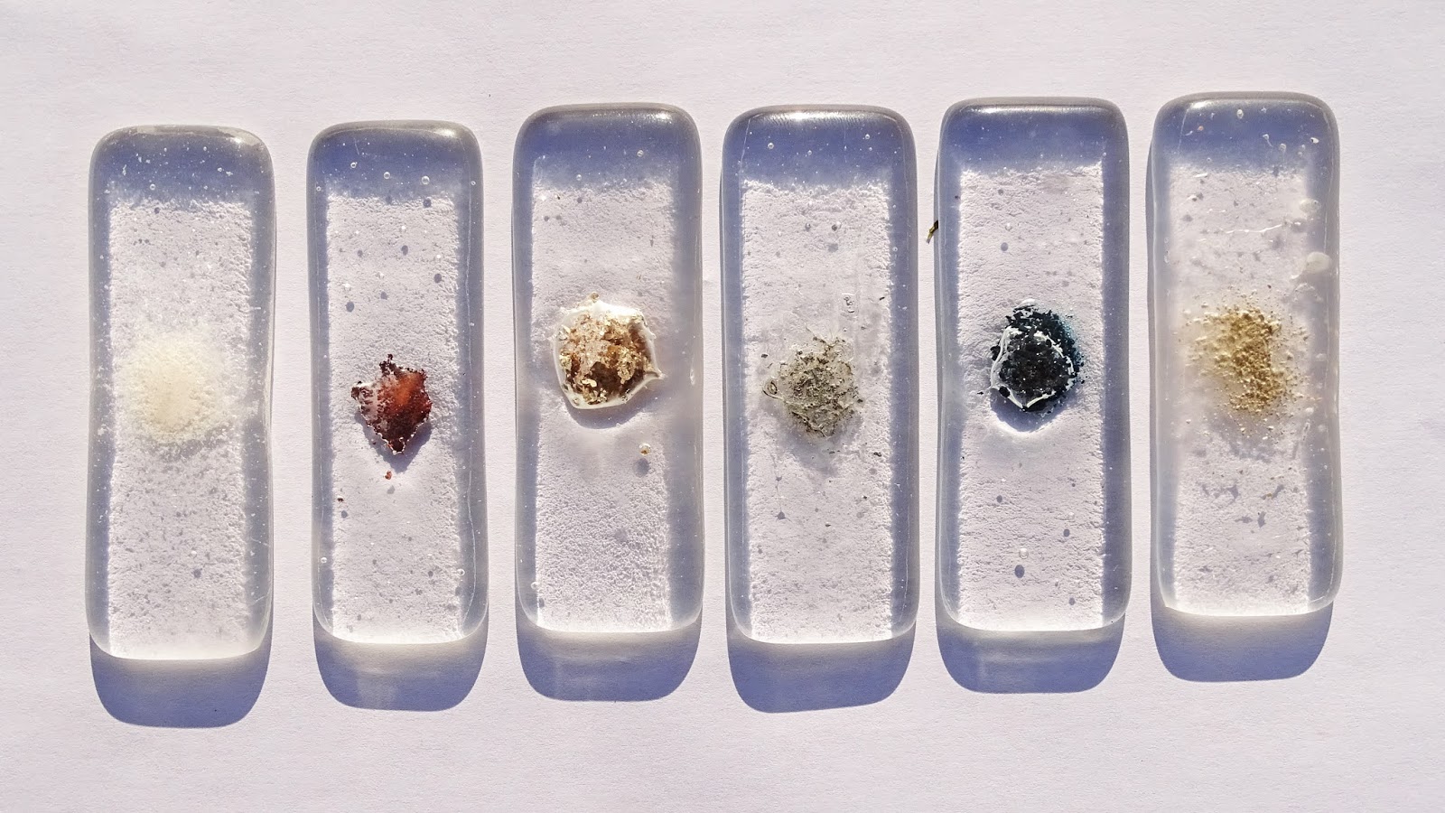 Experiments with mineral inclusions within fused glass