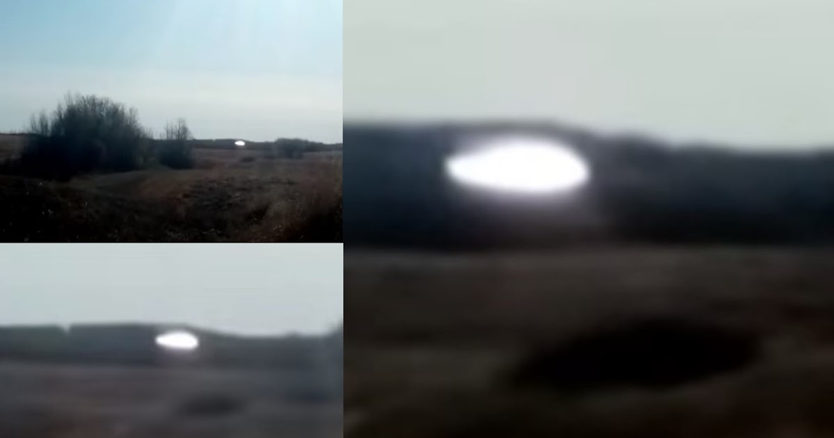 Luminous disk-like UFO flying over field near Saskatchewan, Canada