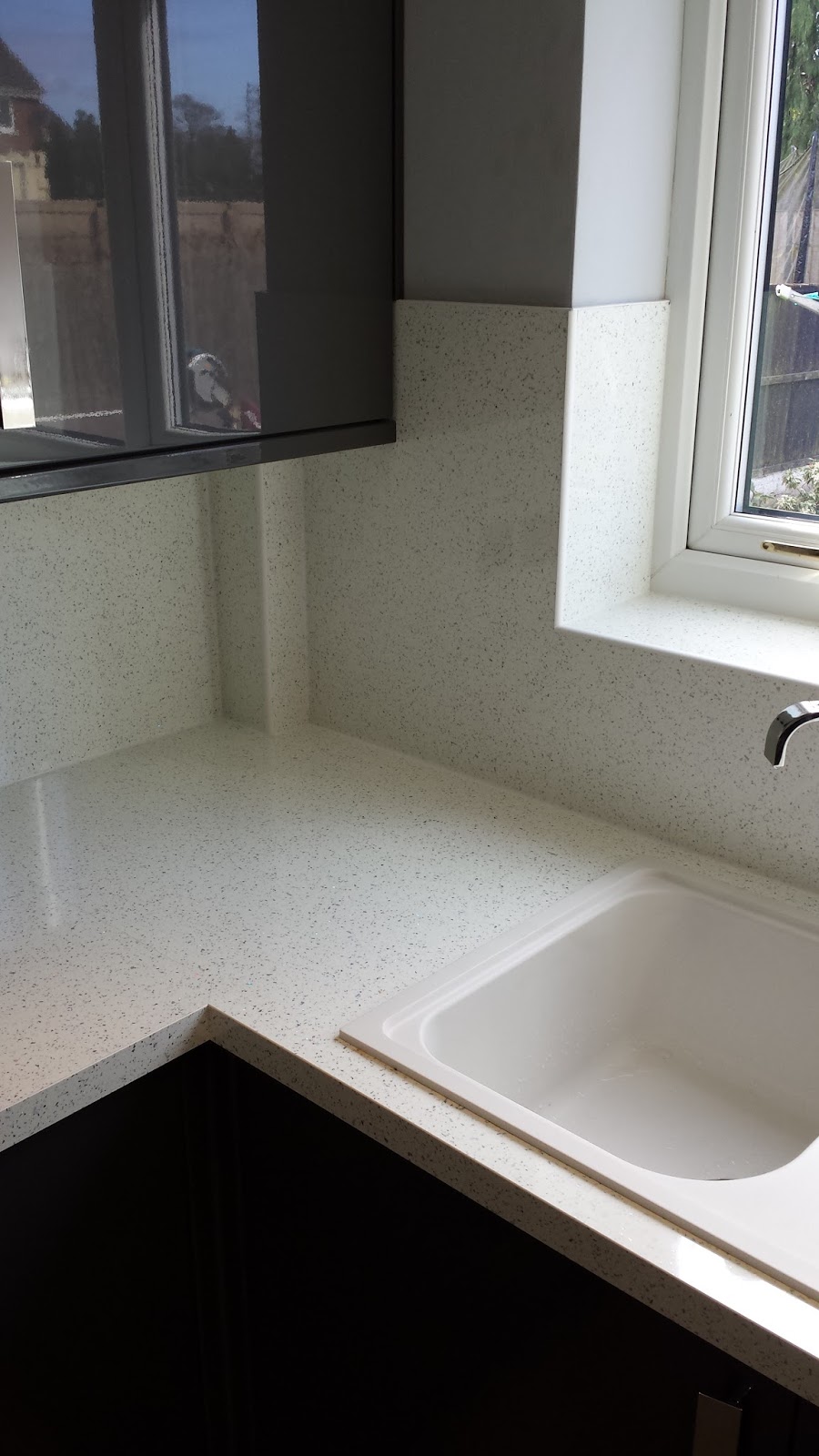 Elm Kitchens and Joinery: Howdens Kitchen in dark grey gloss with a ...