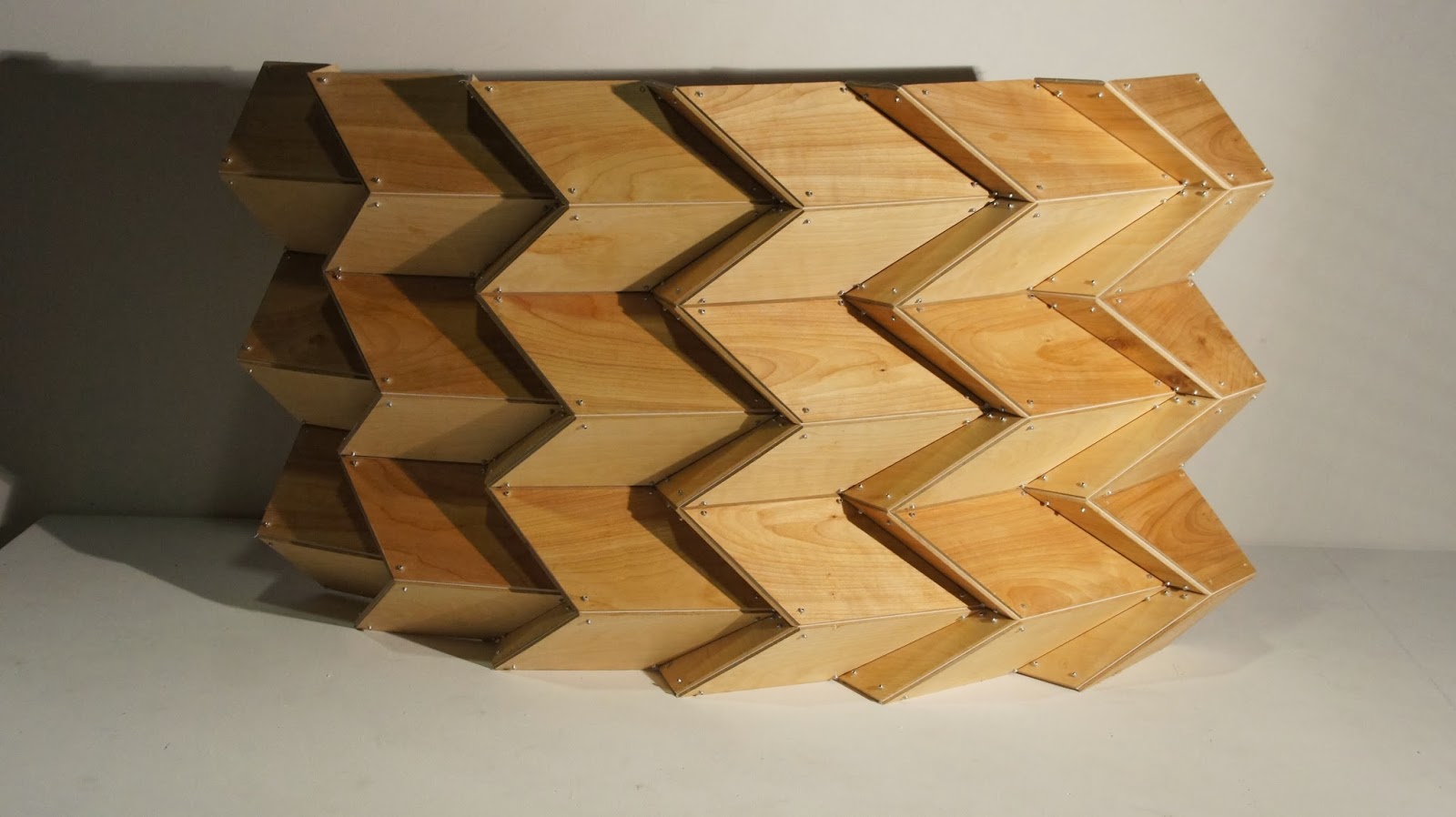 Rigid Folding Structures: V-Pleat Miura-ori Rigid Plate Structure