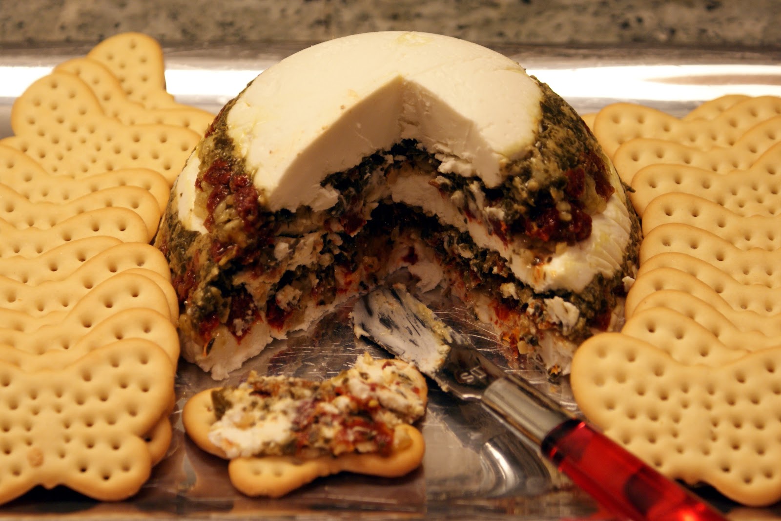 The Baker's Mann: Goat Cheese, Sun-Dried Tomato and Pesto Torta