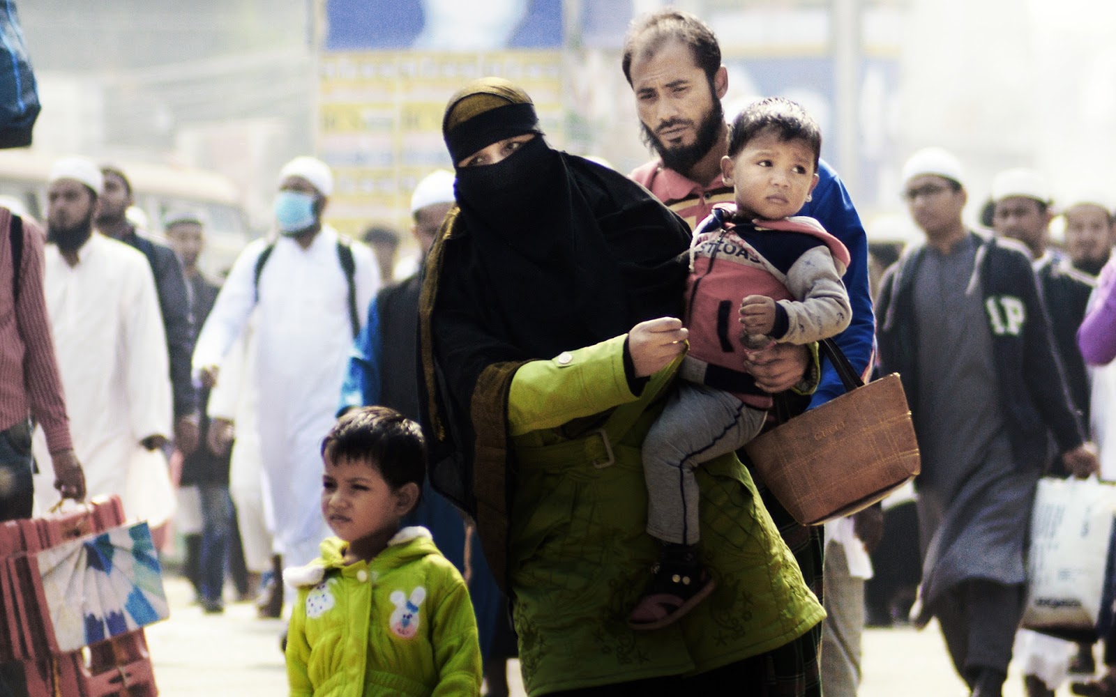 A woman carrying her baby attending World Muslim Congregation