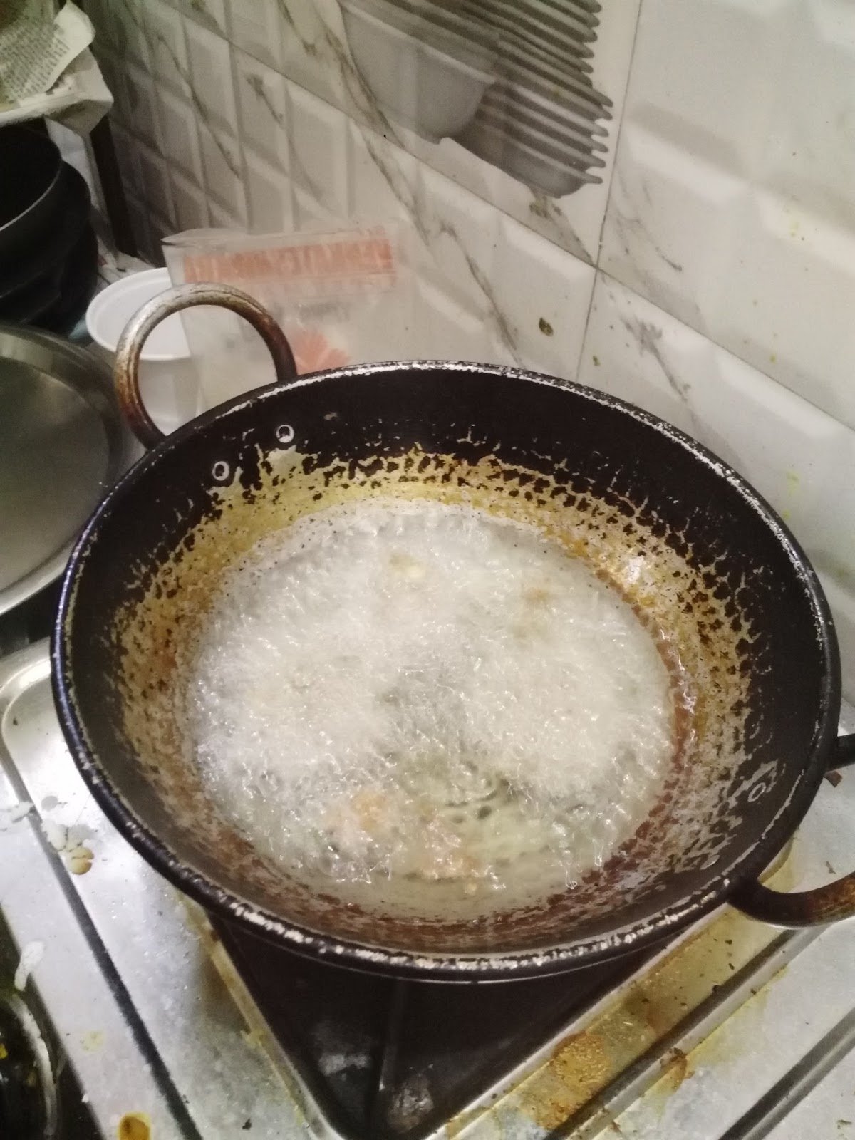 Oil got preheated keep in medium flame and start to deep fry the vaada ...