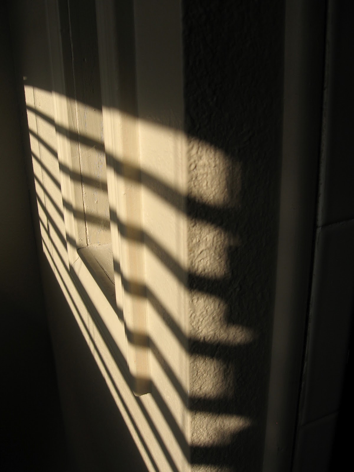Before Leaving the House: shadows on a wall.