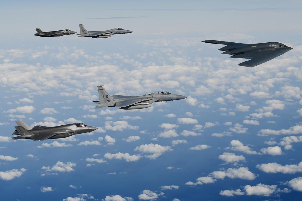 USAF bombers conduct training flights with US F-15s and UK F-35s over ...