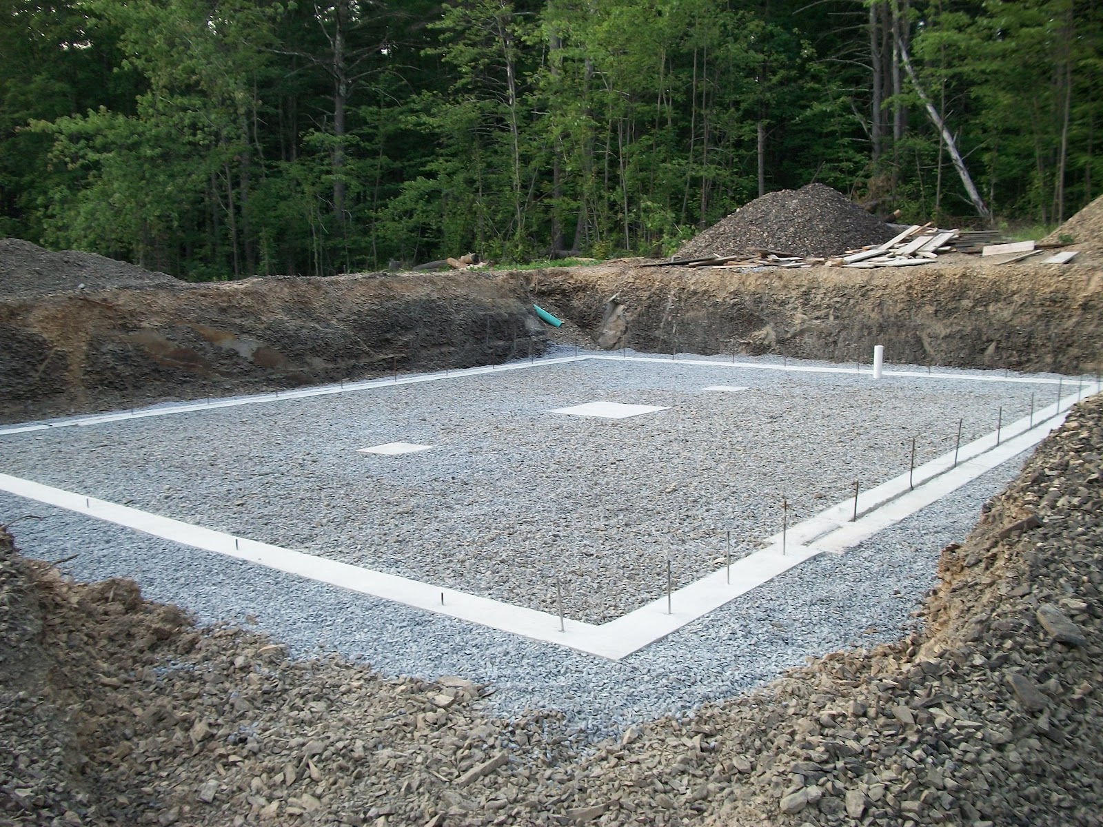 Girl Builds House: Sub-slab #2 stone and footing drain tile.