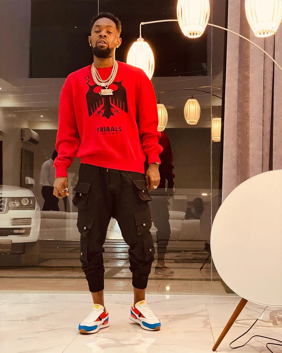 Photo of Patoranking standing at about 5"10 feet tall.