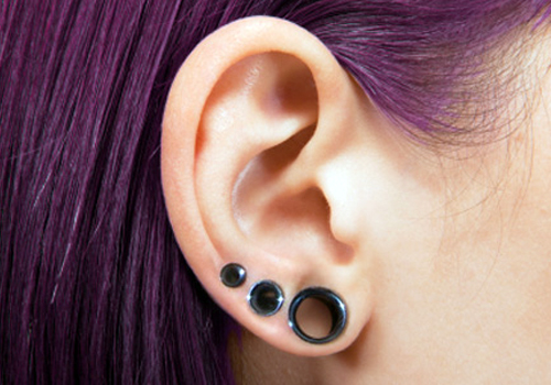 Gauging Ears With Extended Ear Piercings - Tattoos Body Piercings