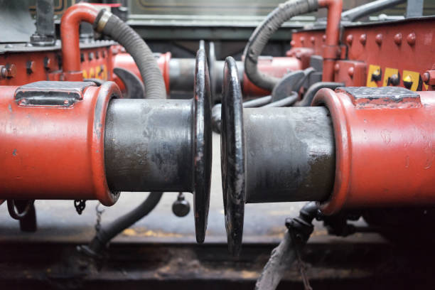 What is the use of these components (buffers) in between the train bogies?