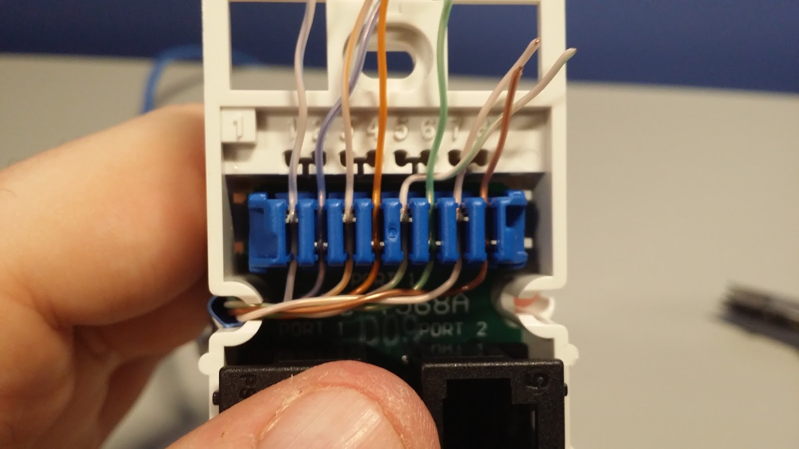 Installing a Wall Jack (Belden PS5E BIX DVO Outlet)