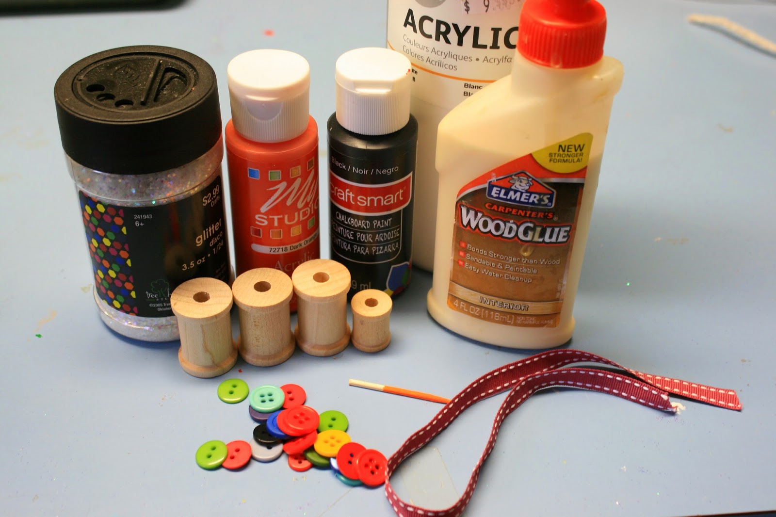 Learning and Exploring Through Play: Snowman Spool Craft