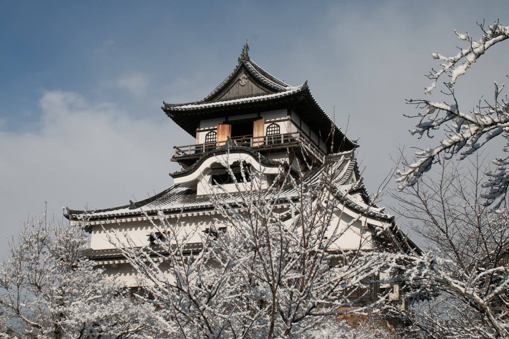 Inuyama Castle -Traditional style original main tower besides river ...